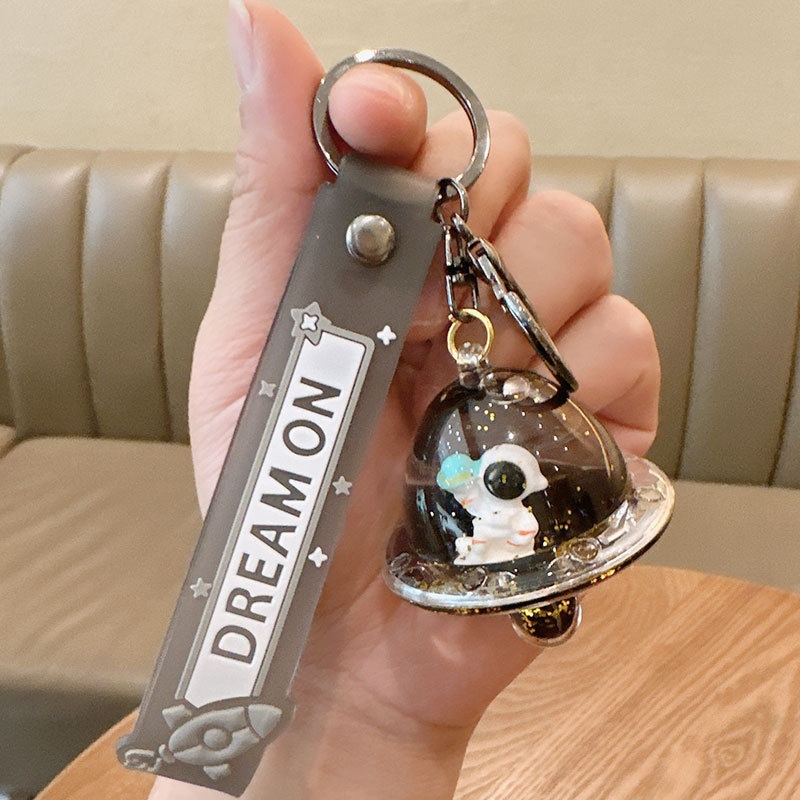 Floating astronaut bubble keychains