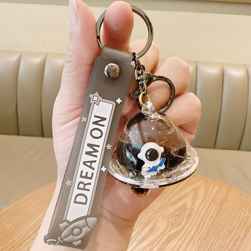 Floating astronaut bubble keychains